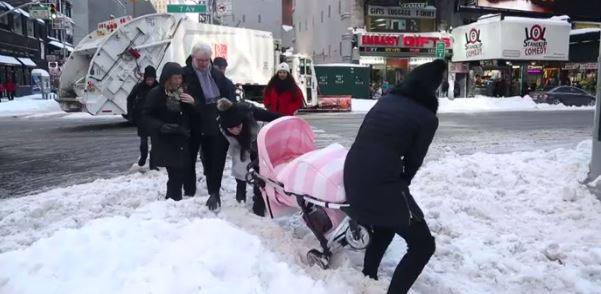 World News: In Pics: Washington struggles to dig out after giant blizzard