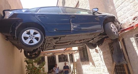 Middle East News: Car gets stuck between two walls following crash in ...